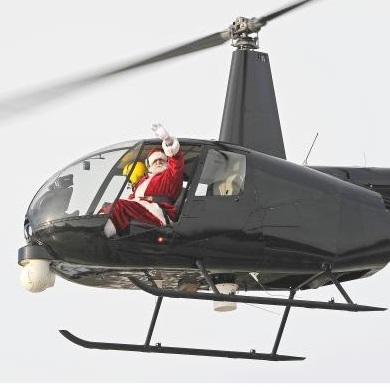 Santa Claus flying in to join our Christmas Carols